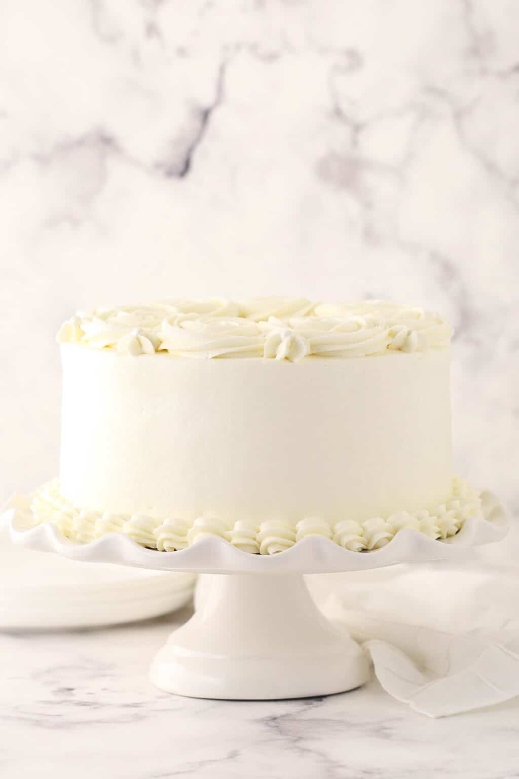 Light and Fluffy White Cake with Whipped Frosting | Life Love & Sugar